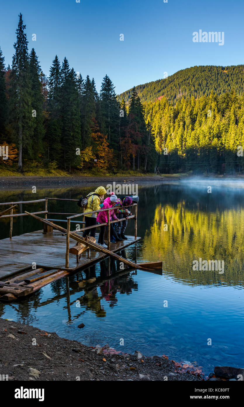 National Park Synevyr, Ukraine - October 23, 2016: tourists on Synevyr ...