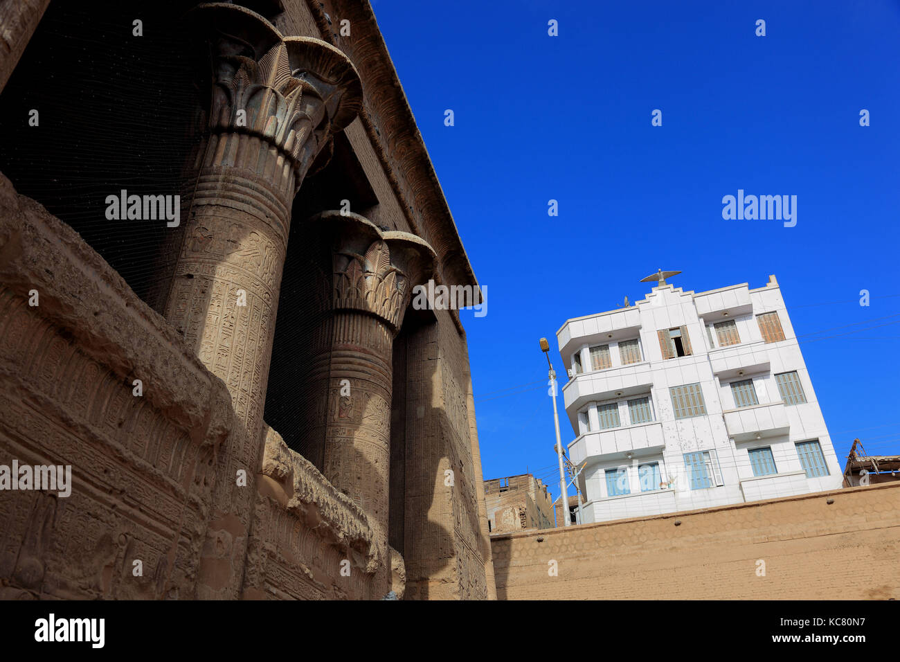 Temple of Khnum, reliefs on the wall and residential building in the ...