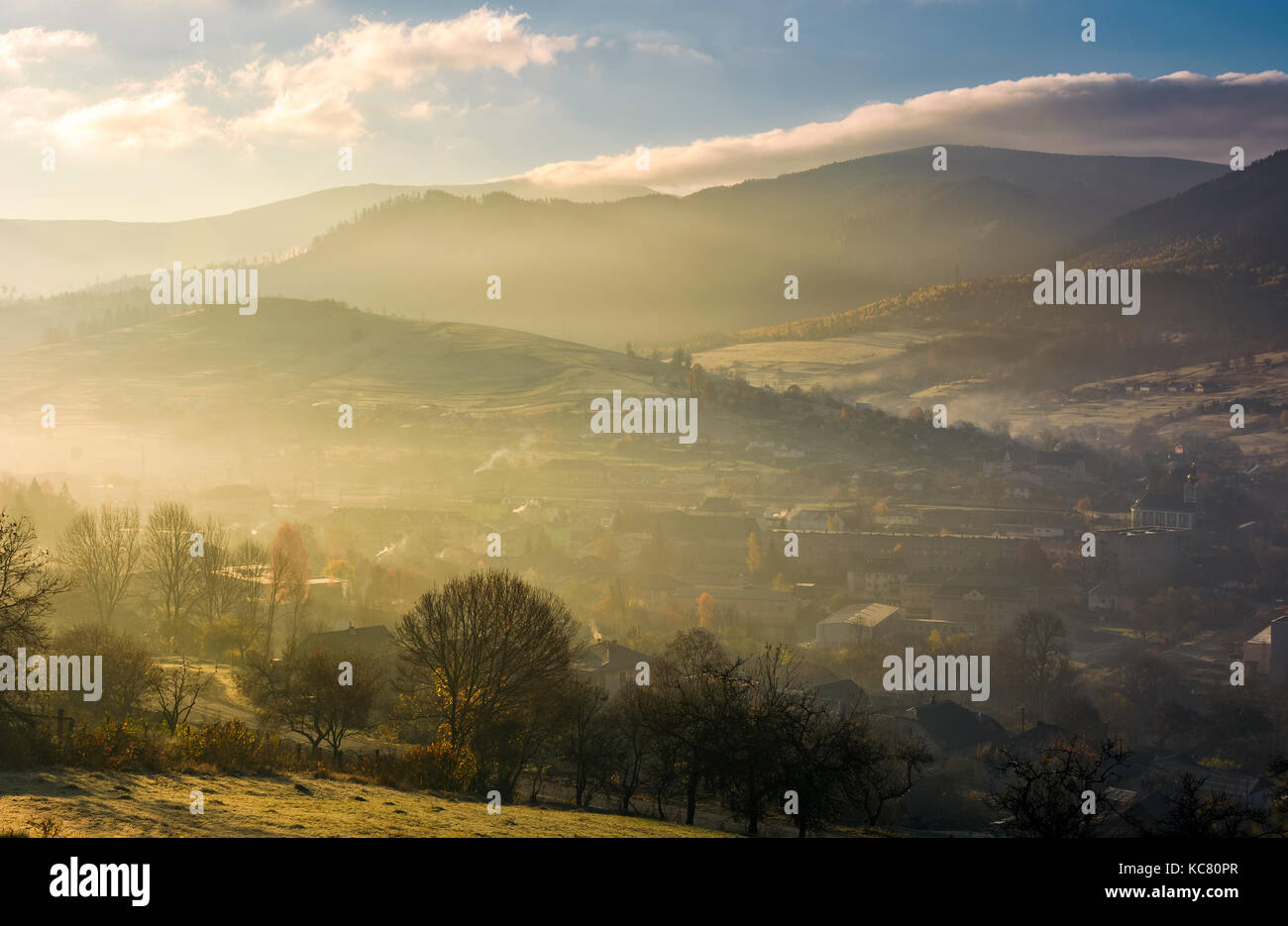 foggy sunrise over the village in valley. gorgeous countryside ...