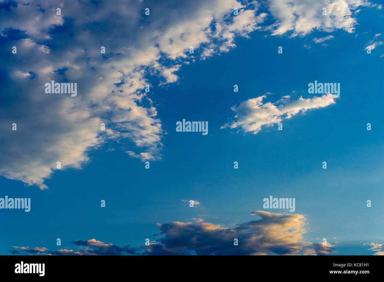 Blue sky with scattered clouds at the beginning of sunset Stock Photo ...