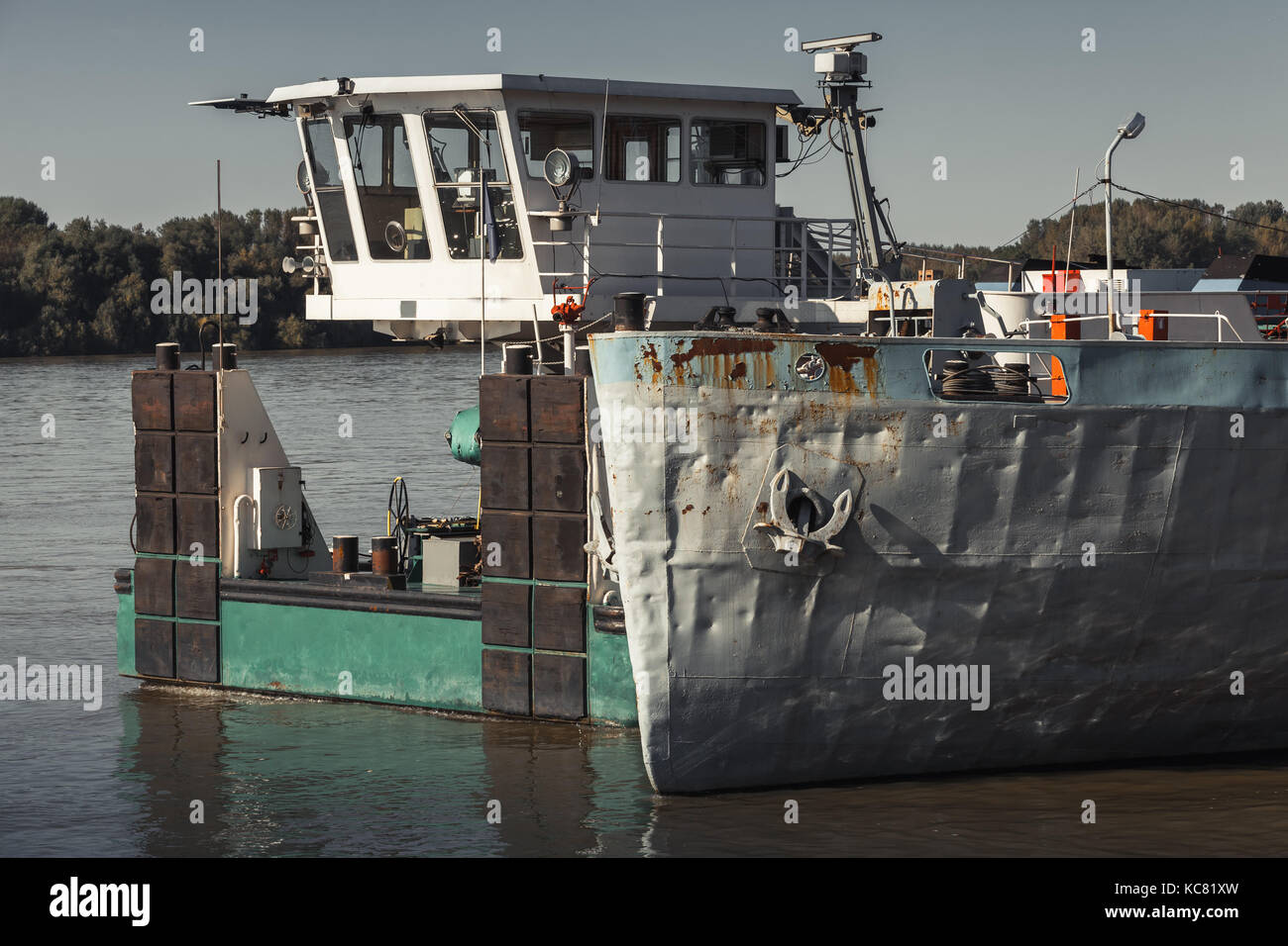 Pusher boat stands moored near cargo ship on Danube river, Ruse ...