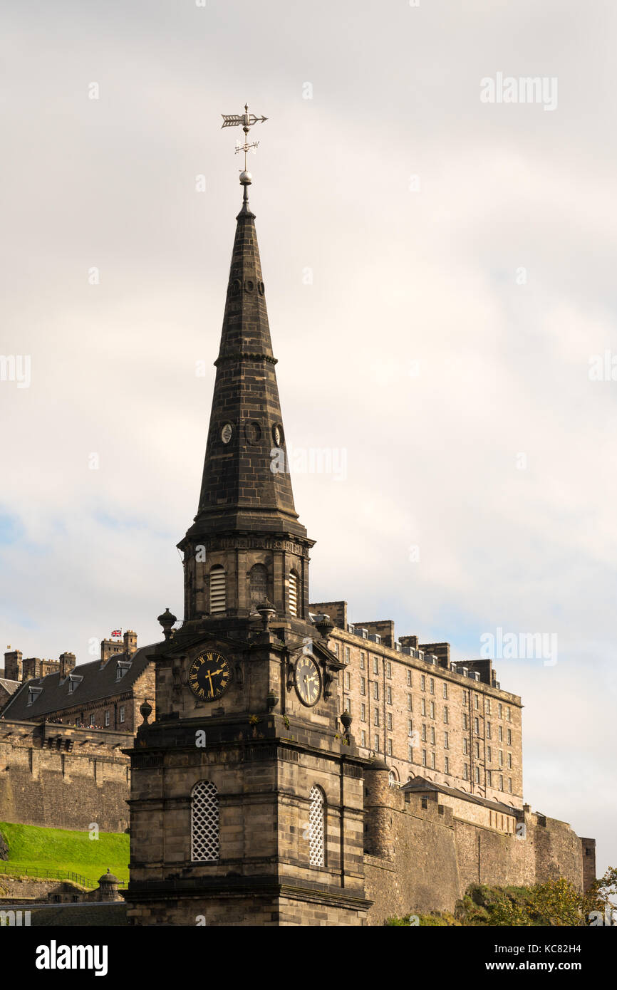 The spire of St Cuthbert's church, with Edinburgh castle in the ...