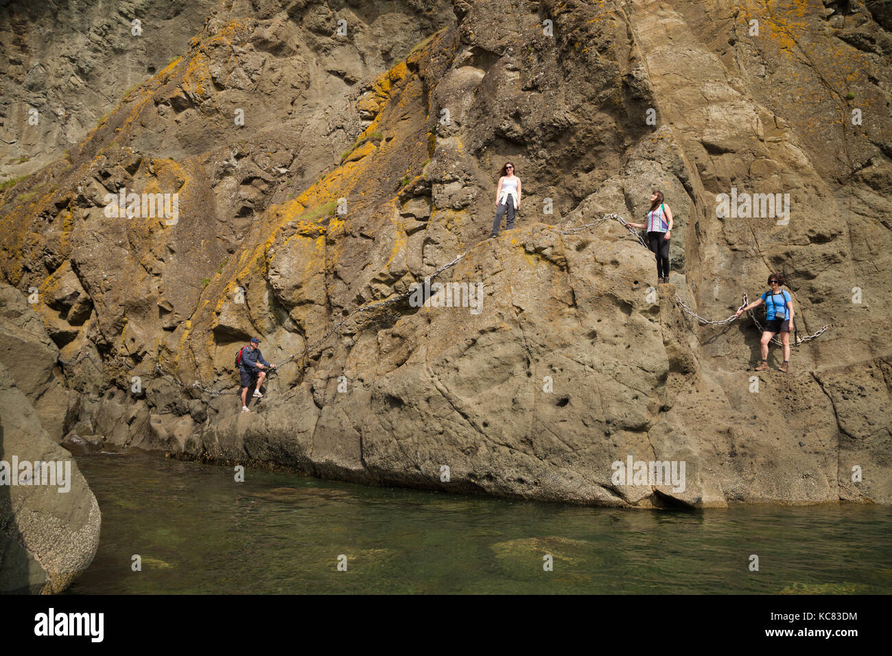 Four people on the Chain Walk, Elie, Fife, Scotland Stock Photo - Alamy