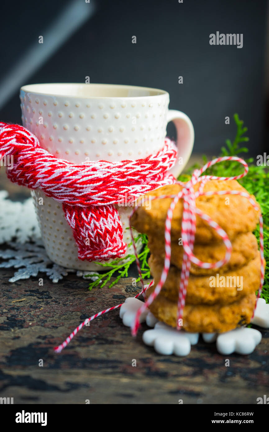 Cup of tea with lemon and cinnamon spice and Christmas decoration on ...