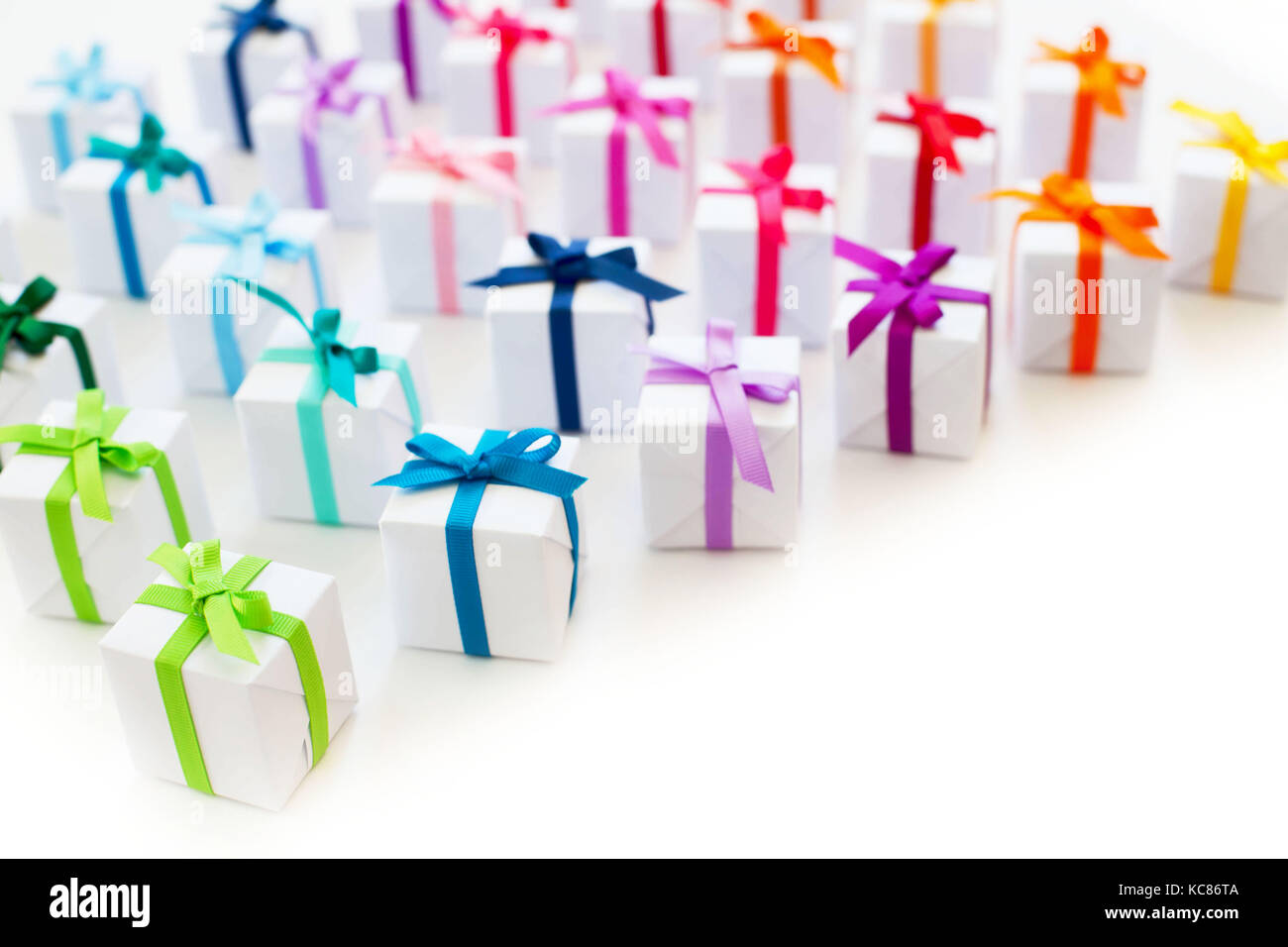 Colorful gift boxes on white background Stock Photo - Alamy