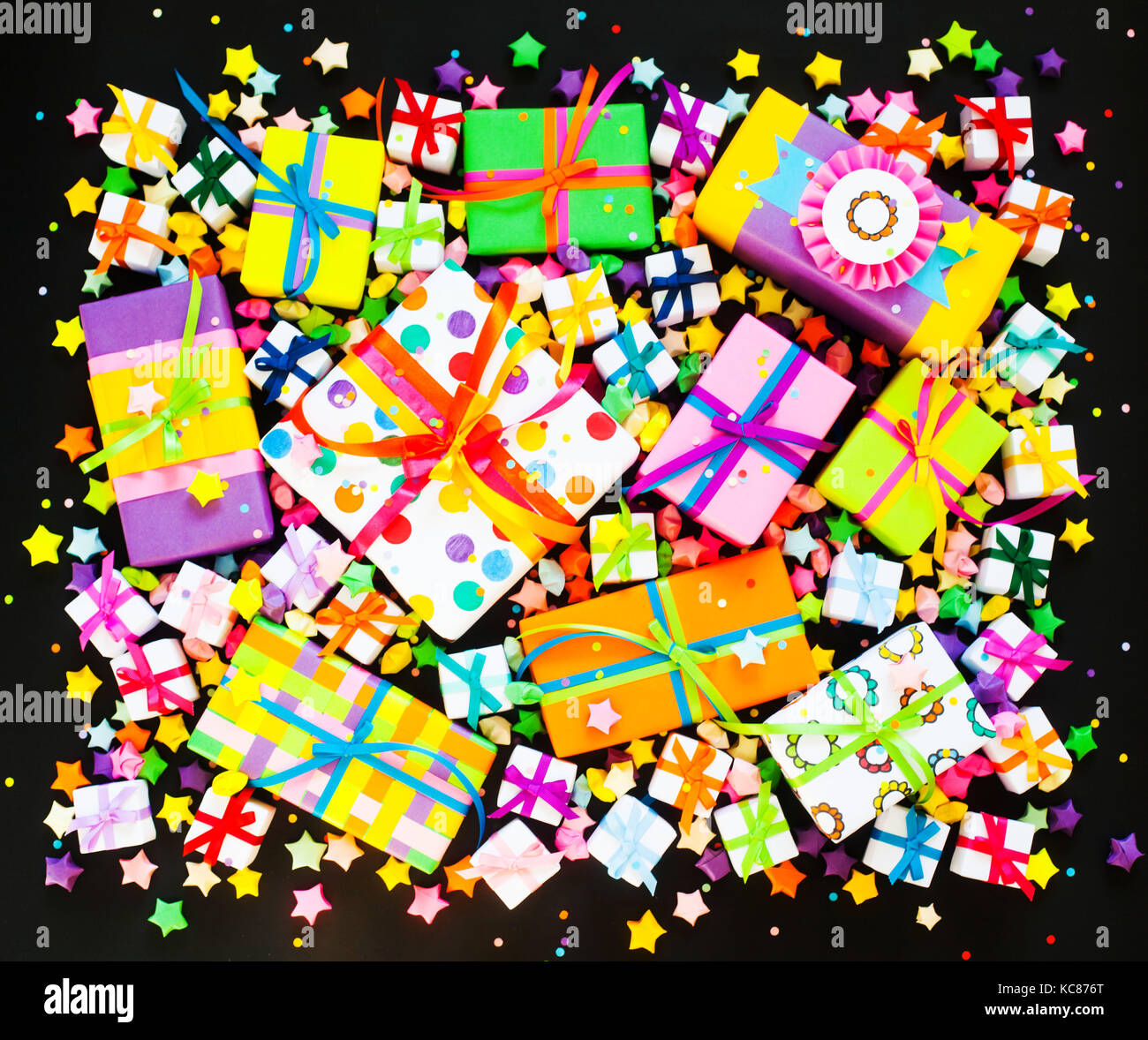 Colored gift boxes with colorful ribbons Stock Photo - Alamy
