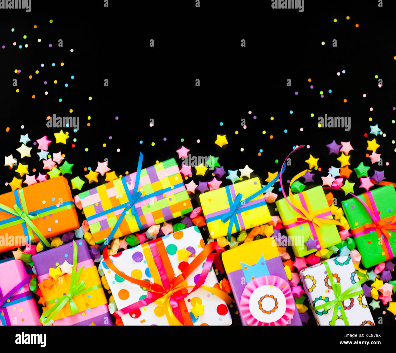 Colored gift boxes with colorful ribbons Stock Photo - Alamy