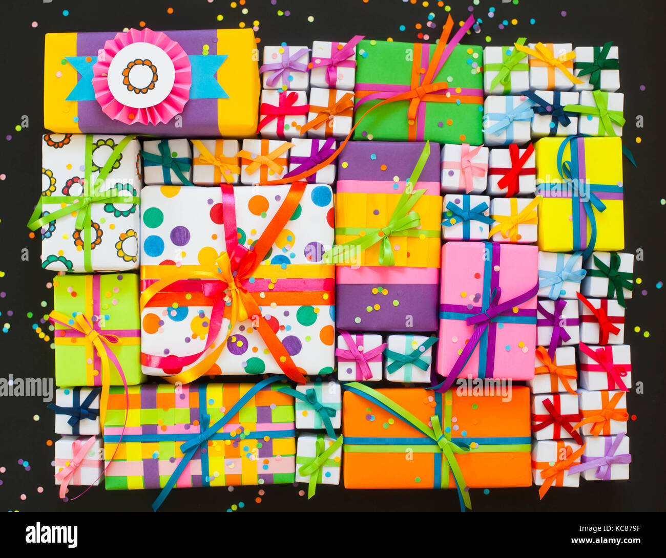 Colored gift boxes with colorful ribbons. Gifts for Christmas or a ...