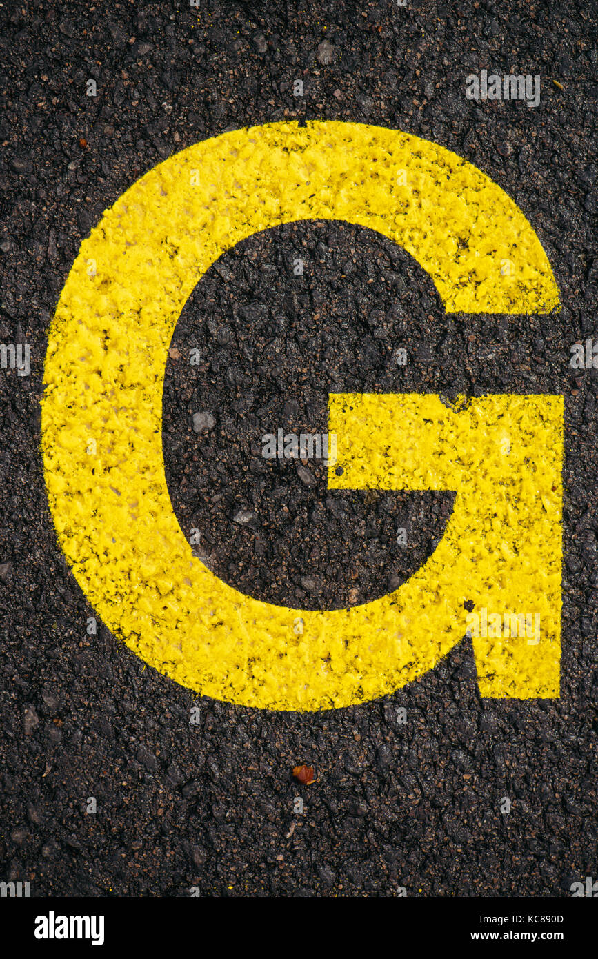 Letter G on asphalt road, top view Stock Photo - Alamy