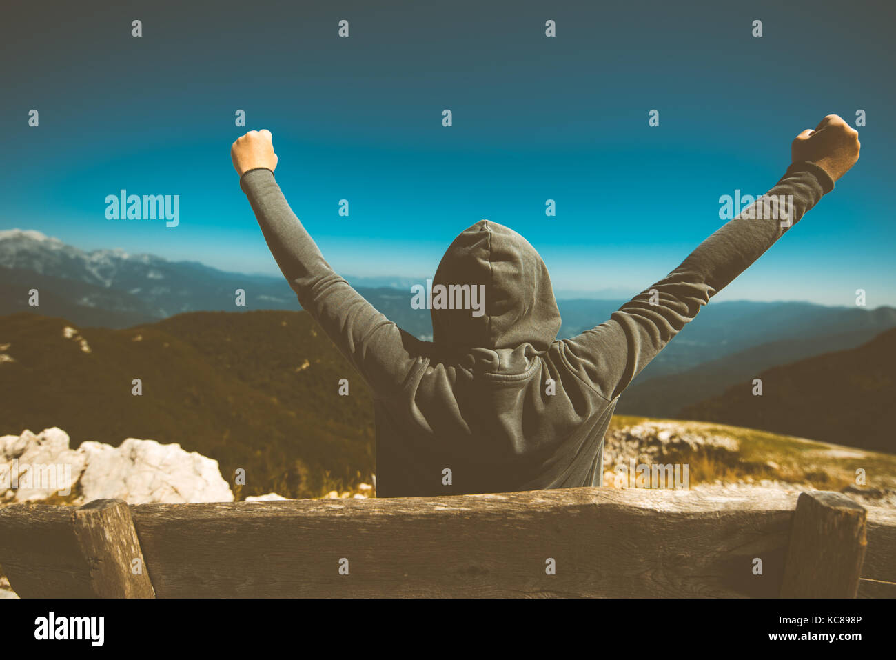 Success, triumph and victory. Victorious female person standing on ...