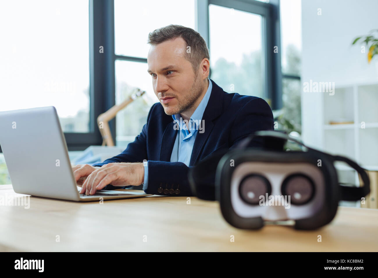 Serious handsome man being at work Stock Photo - Alamy