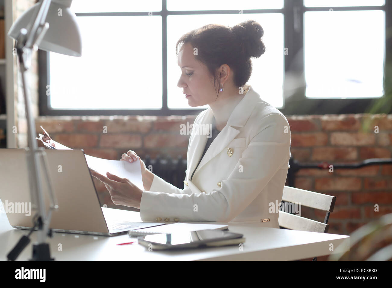 Woman working in call center as dispatcher Stock Photo - Alamy