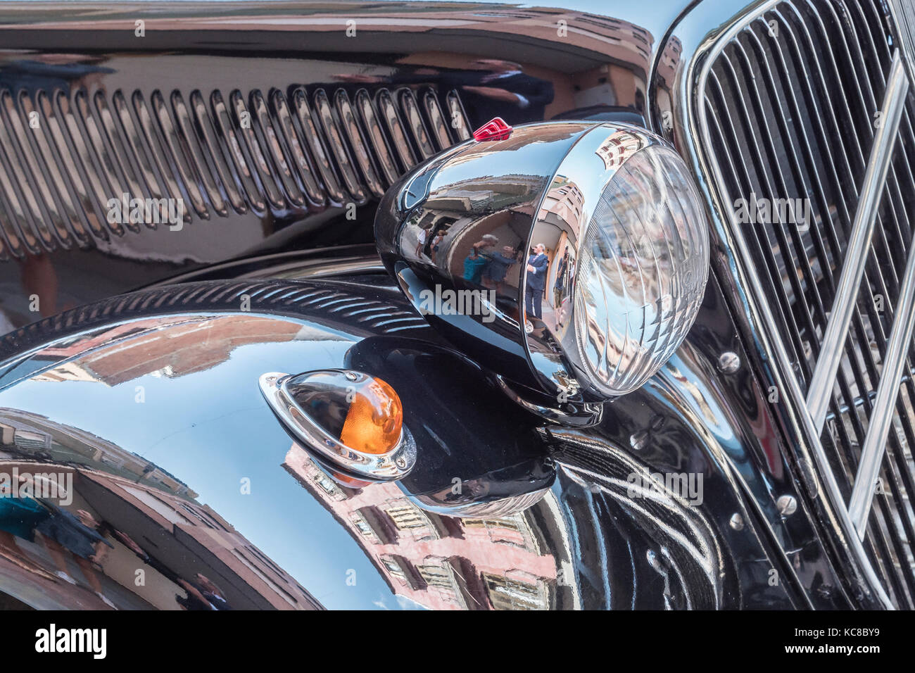 Headlight and intermittent detail in a classic black car Stock Photo ...