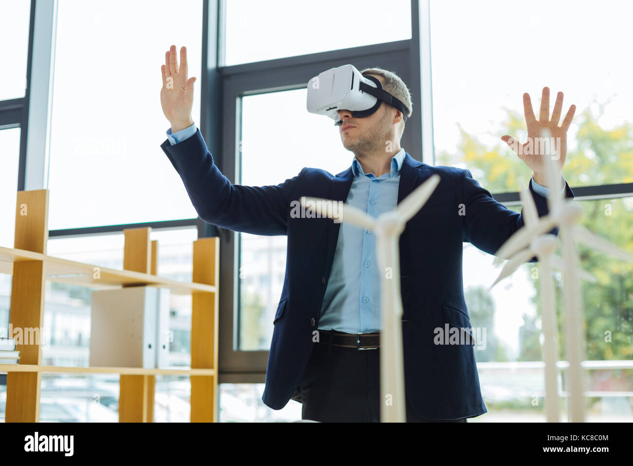 Smart pleasant man using modern technologies Stock Photo - Alamy