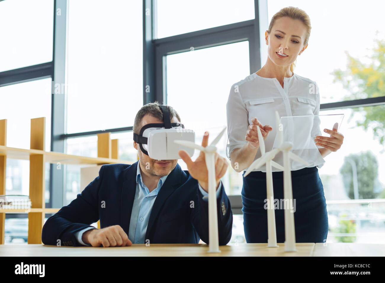 Nice professional colleagues using modern technologies Stock Photo - Alamy