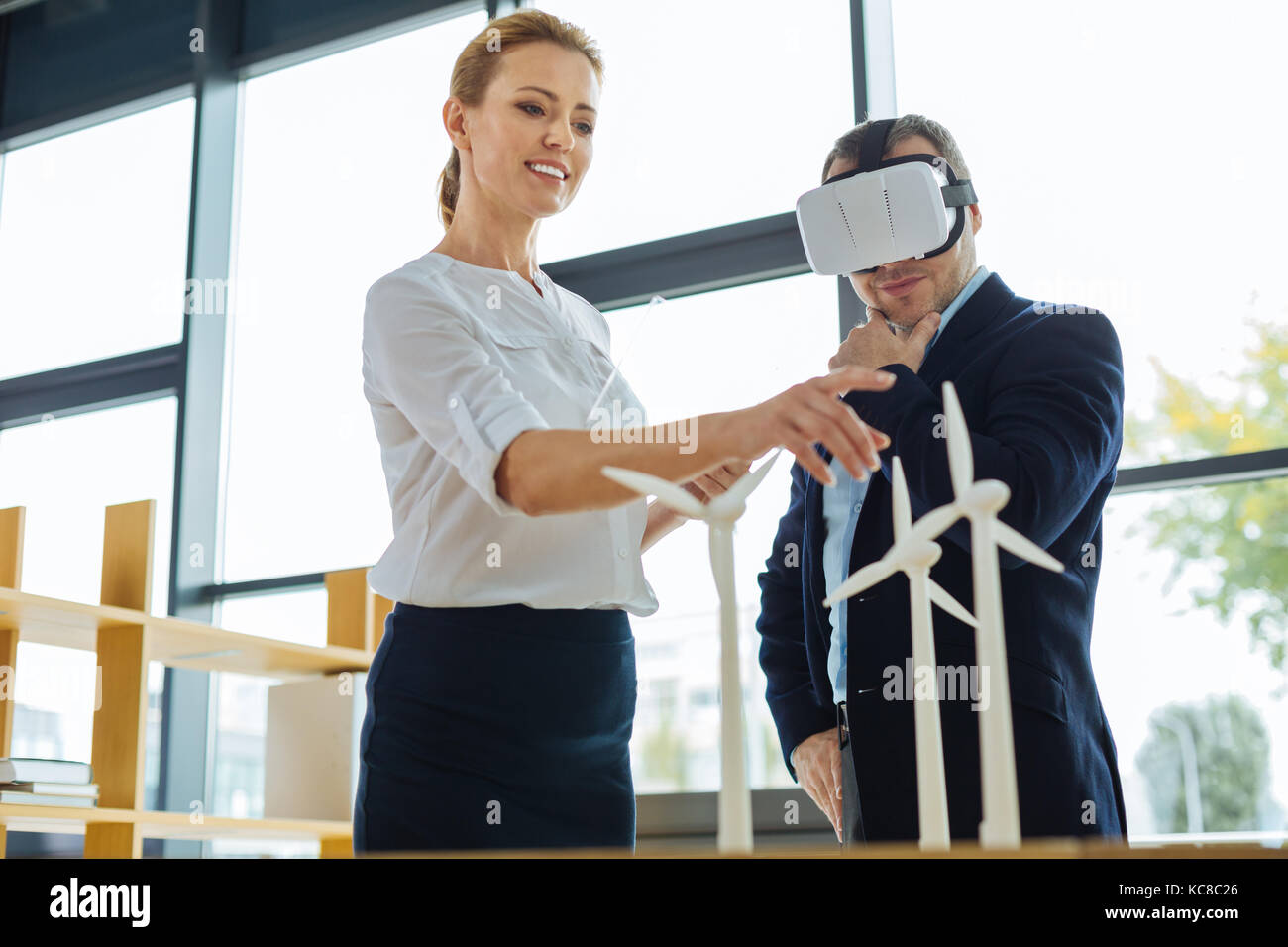 Nice positive colleagues working together Stock Photo - Alamy