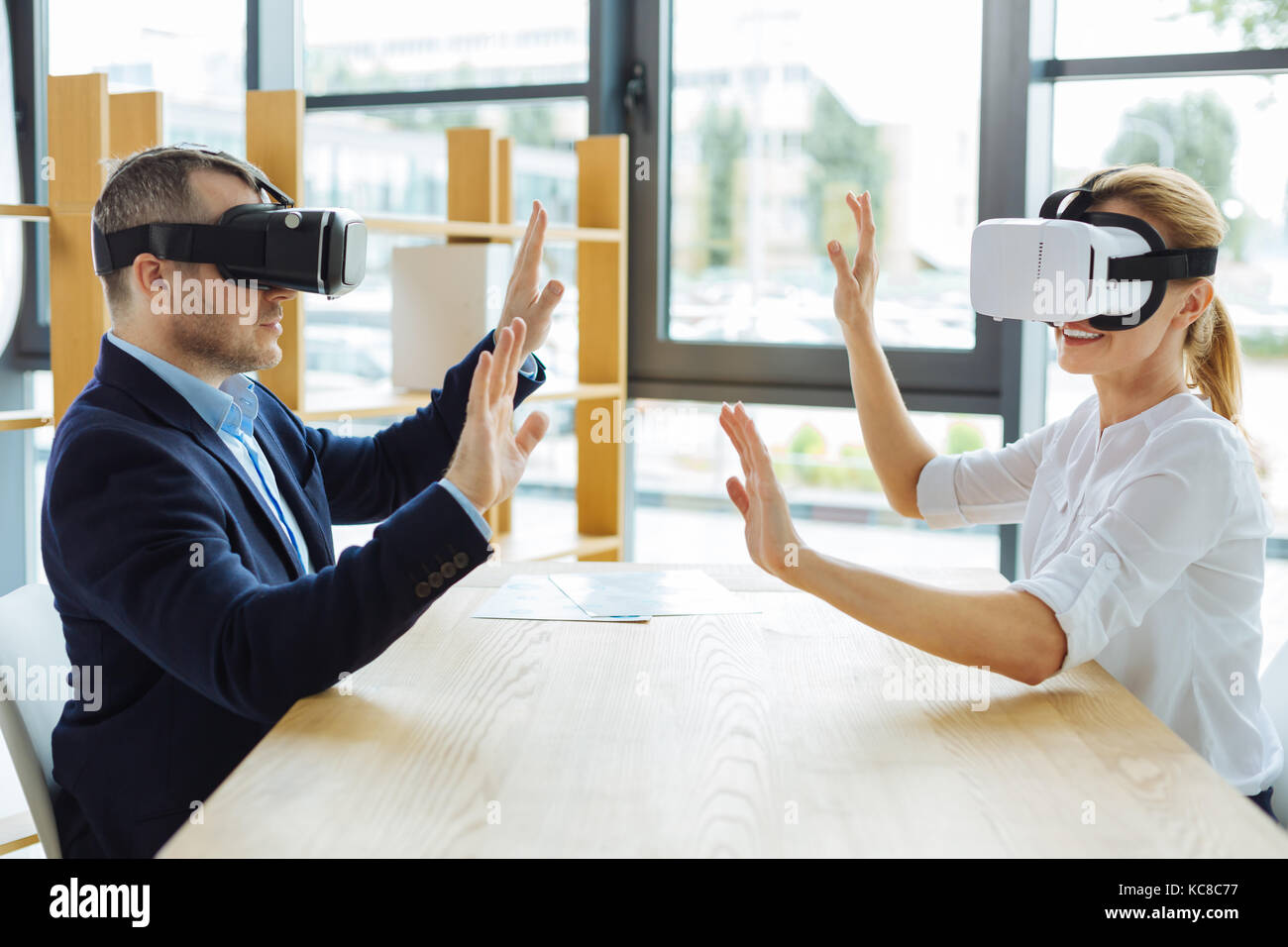 Delighted nice people testing 3d technology Stock Photo - Alamy