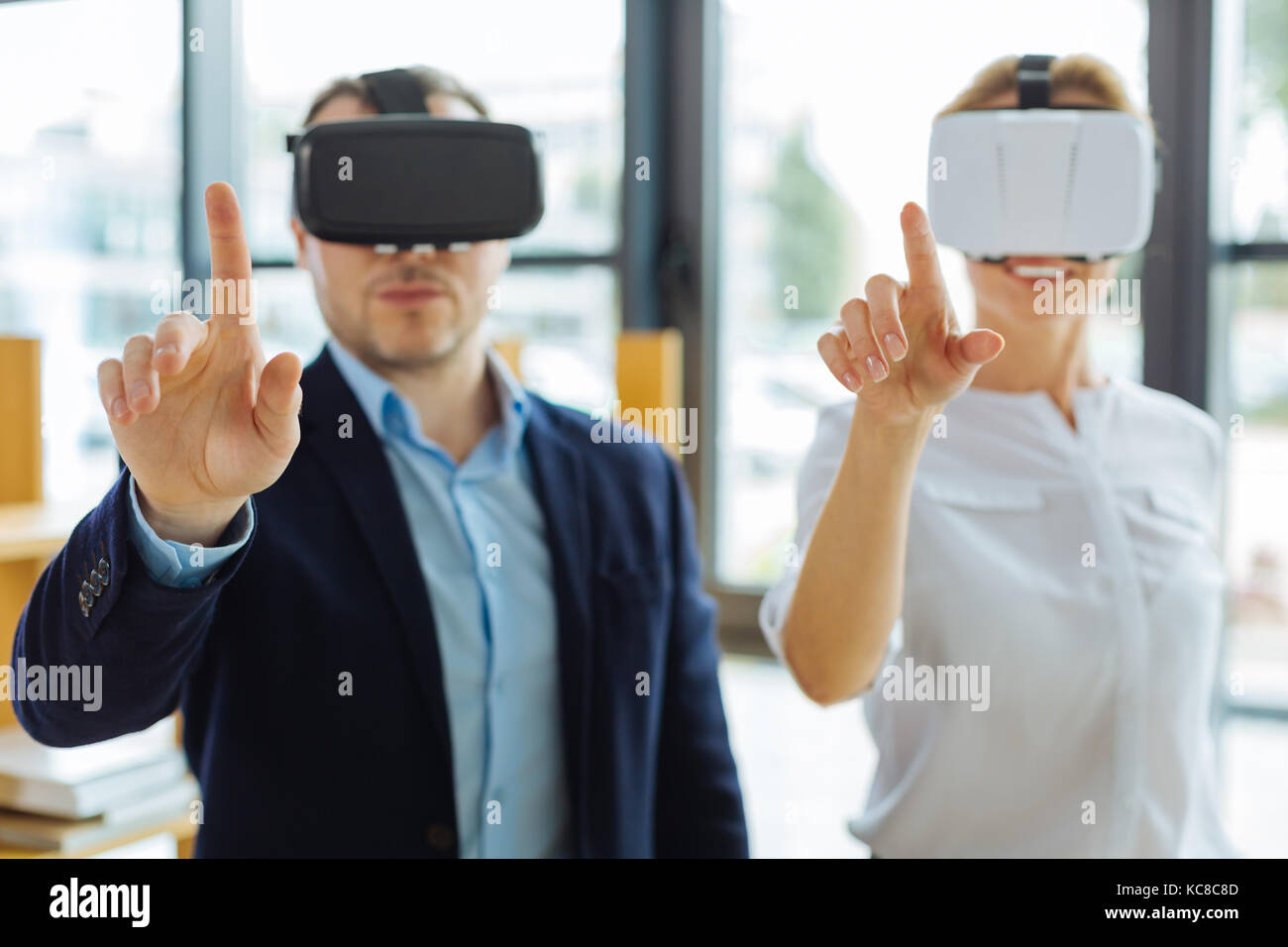 Nice cheerful people standing in front of the virtual screen Stock ...