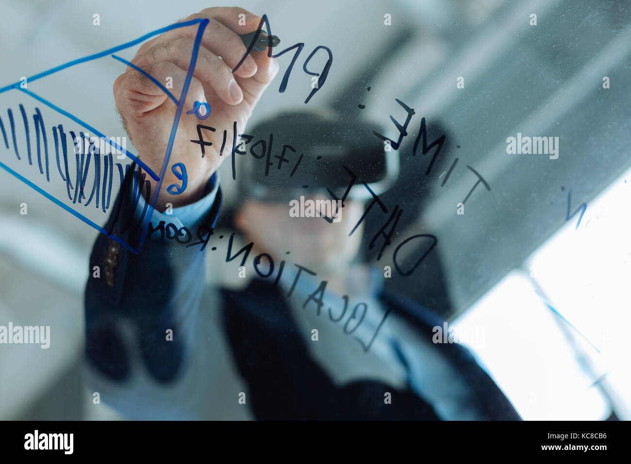 Man writing on board digital hi-res stock photography and images - Alamy