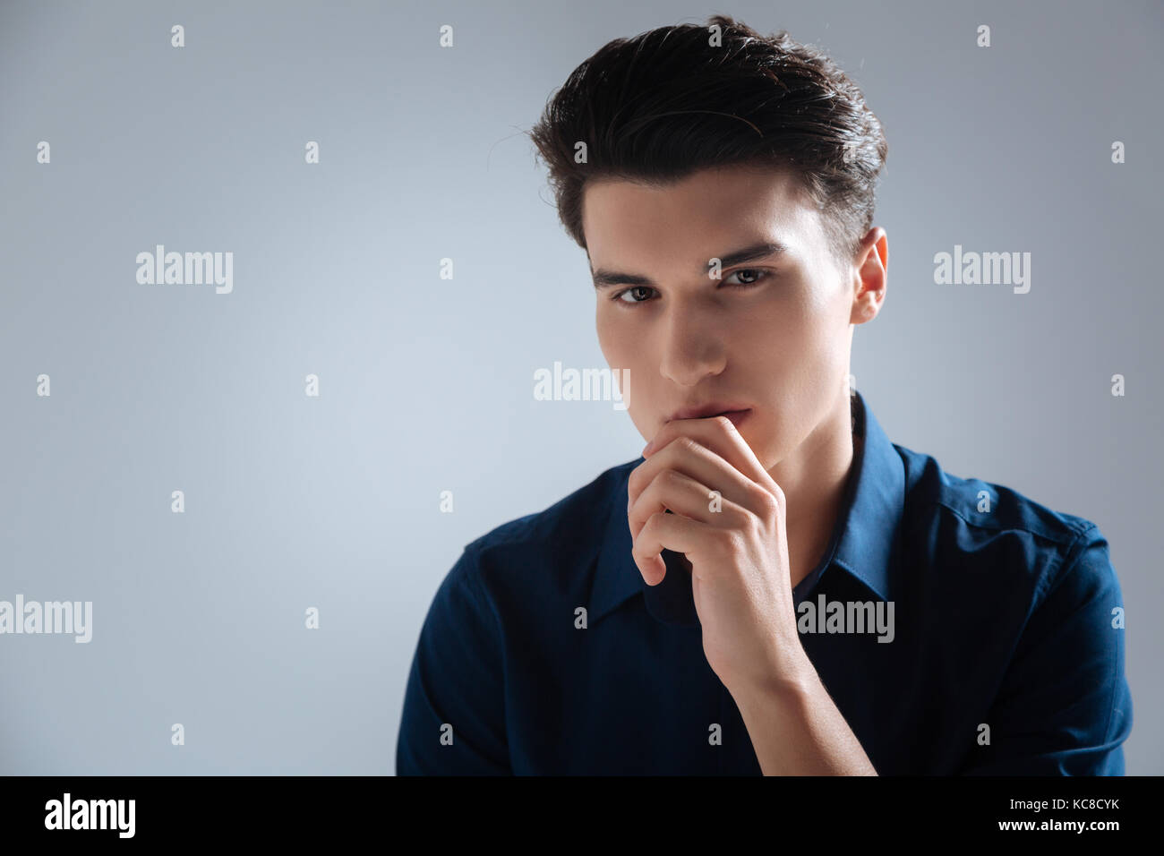 Attractive male person thinking about future Stock Photo - Alamy