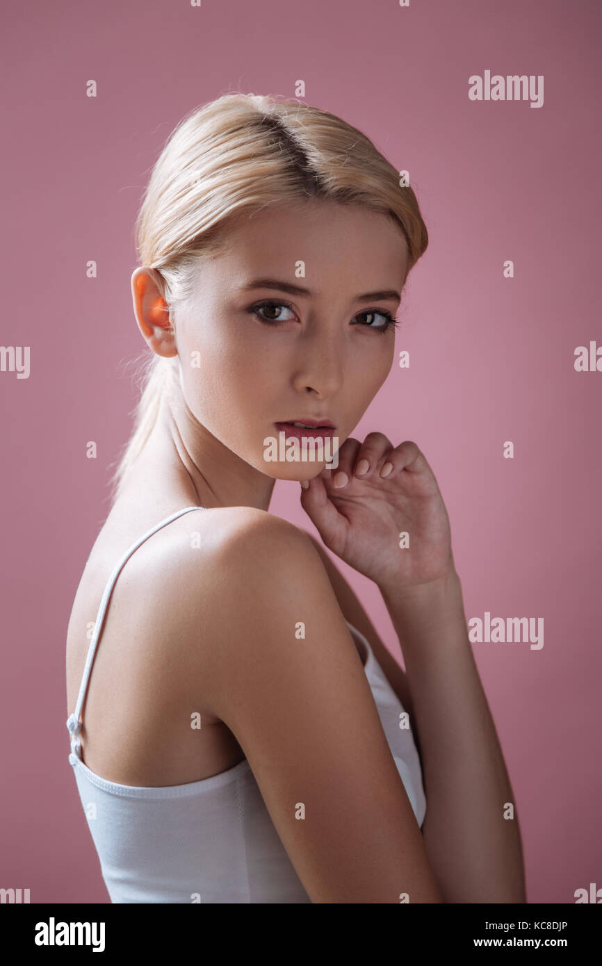 Attentive blonde touching her chin Stock Photo - Alamy Attentive blonde touching her chin Stock Photo - Alamy