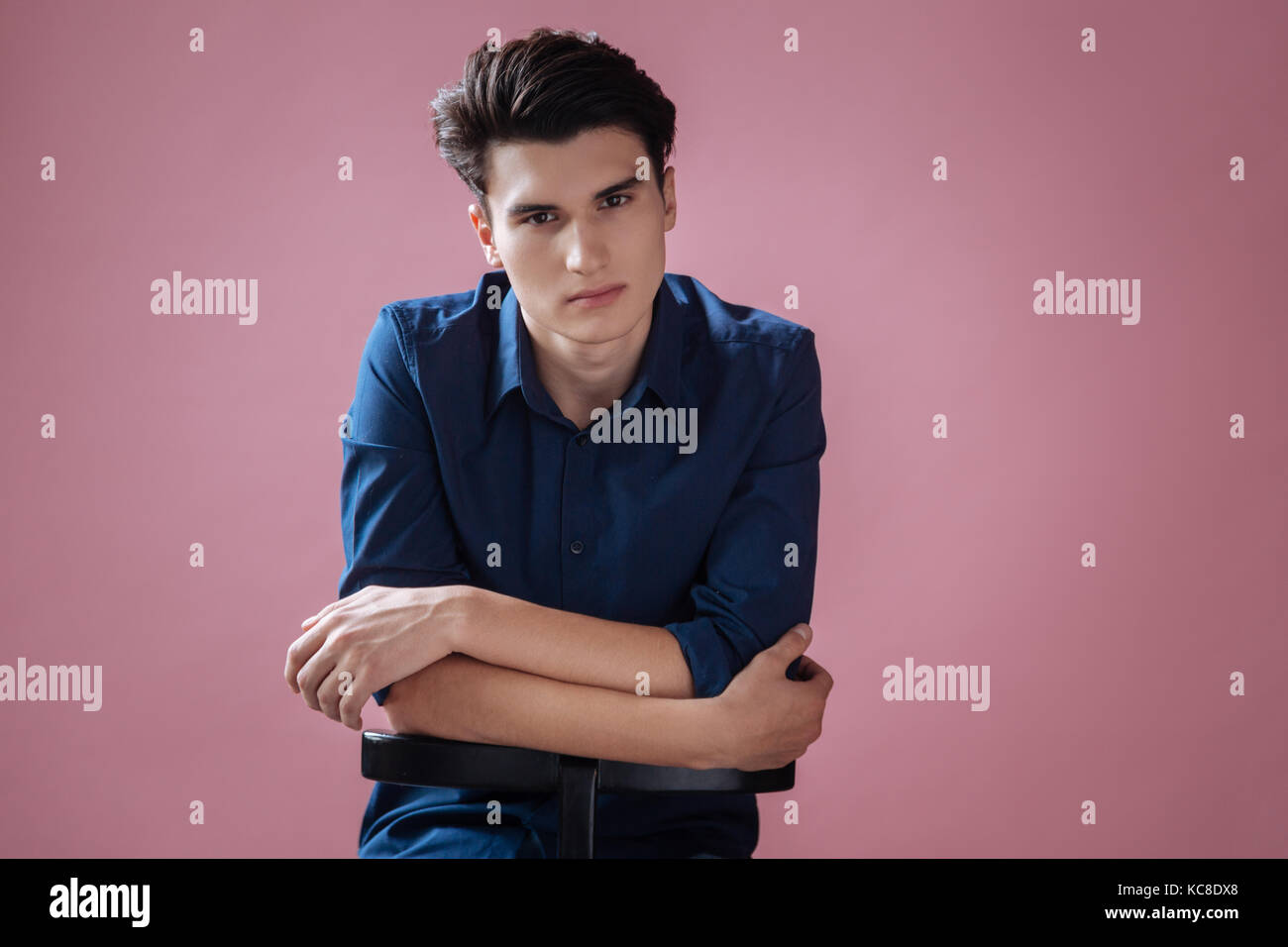 Serious male person crossing arms Stock Photo - Alamy