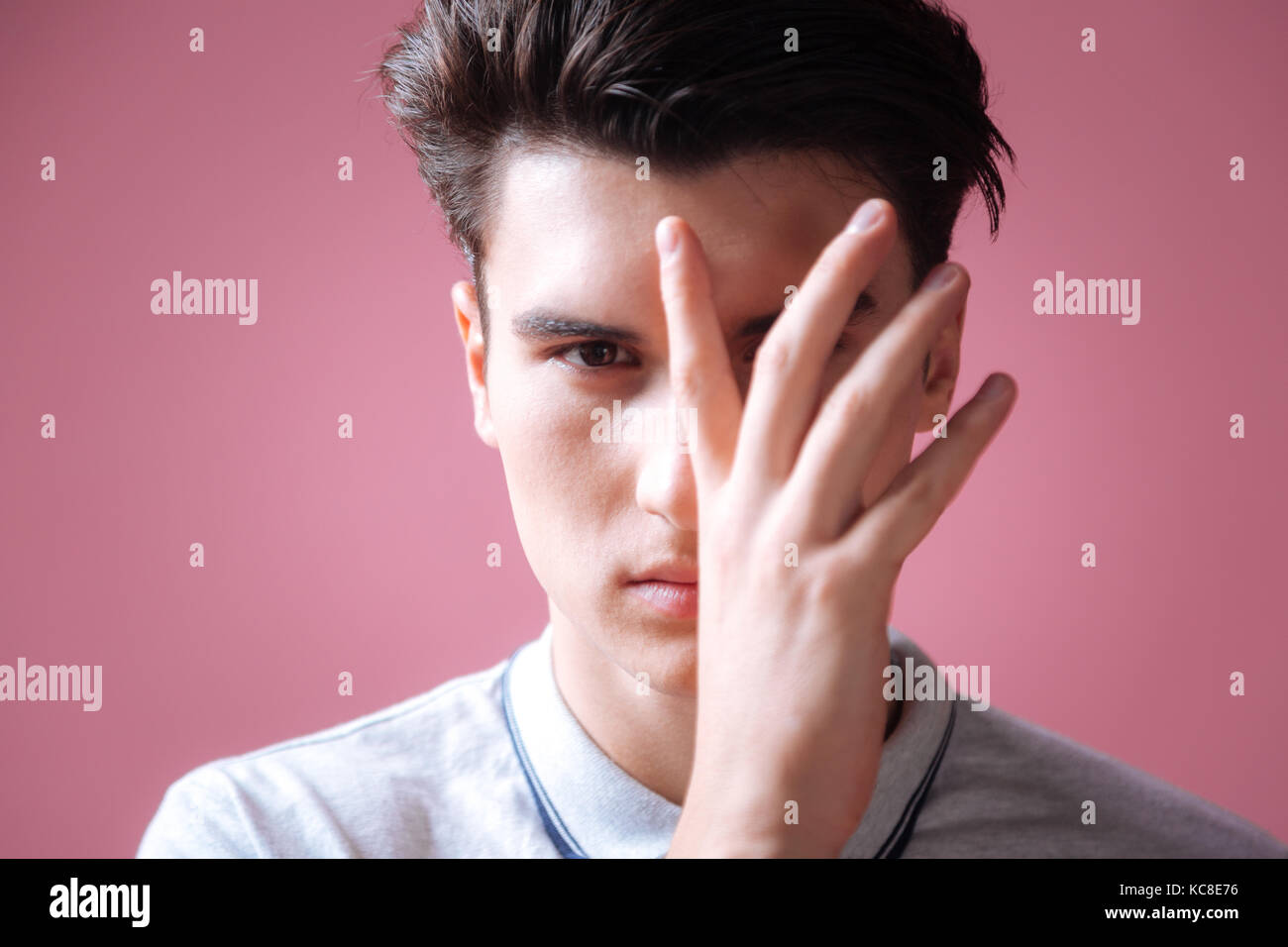 Portrait of handsome man that showing his hand Stock Photo - Alamy