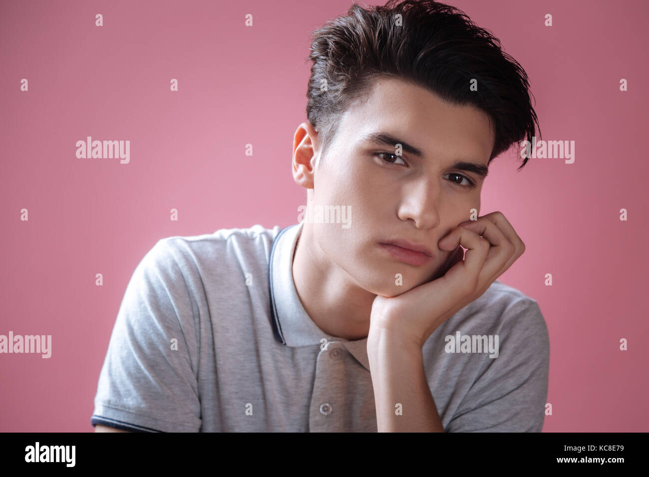 Frustrated male person posing on camera Stock Photo - Alamy