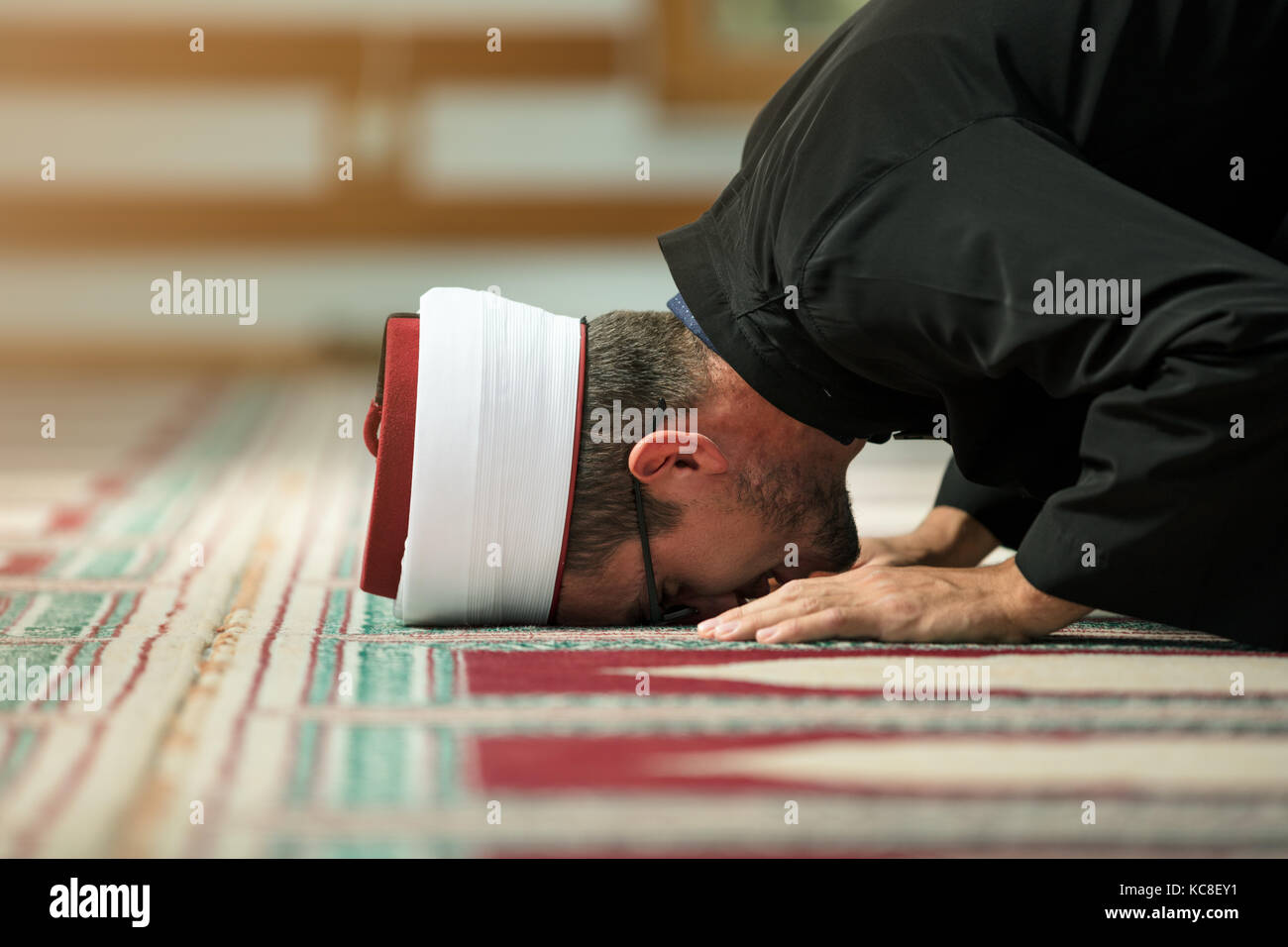 Young Imam praying inside of beautiful mosque Stock Photo - Alamy