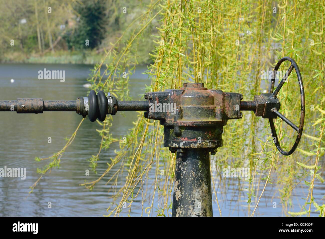 Vintage lock mechanism by pond Stock Photo - Alamy