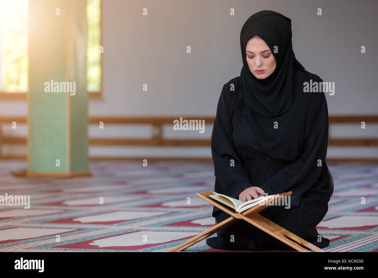 Young muslim woman praying in mosque Stock Photo - Alamy