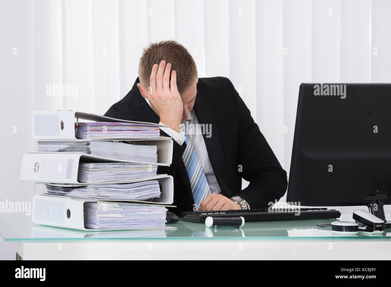 Photo Of Young Depressed Businessman Sitting In Office Stock Photo - Alamy