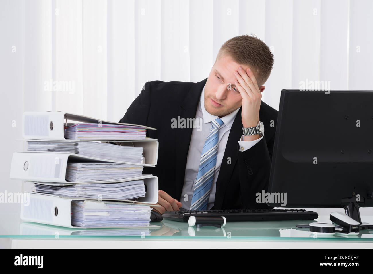 Confused businessman in black hi-res stock photography and images - Alamy