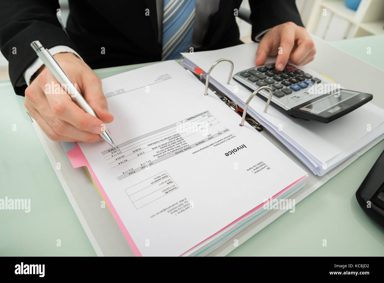 Close-up Of A Businessman Calculating Invoice With Calculator Stock ...