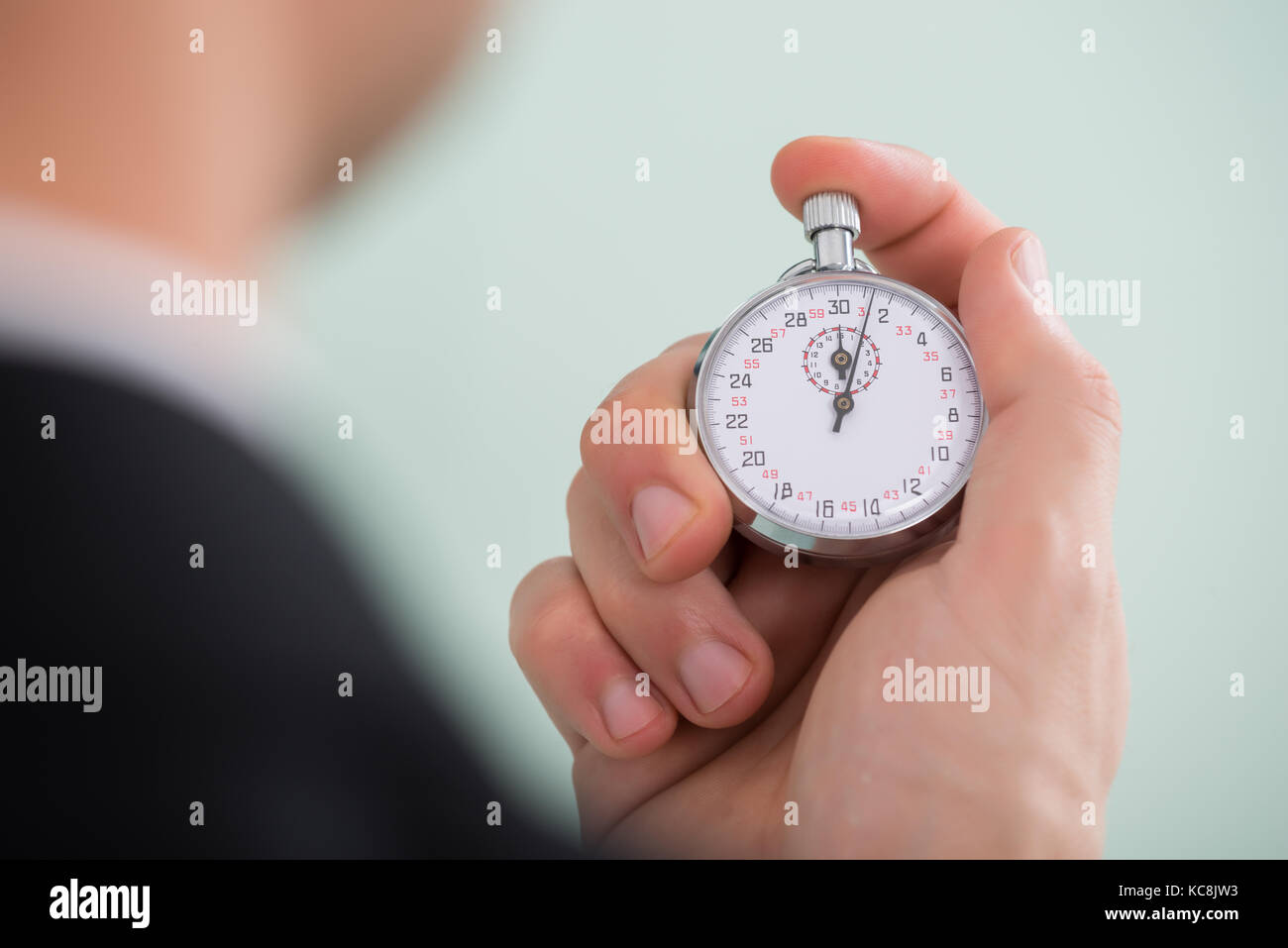 Close-up Photo Of Person Hand Holding Stopwatch Stock Photo - Alamy