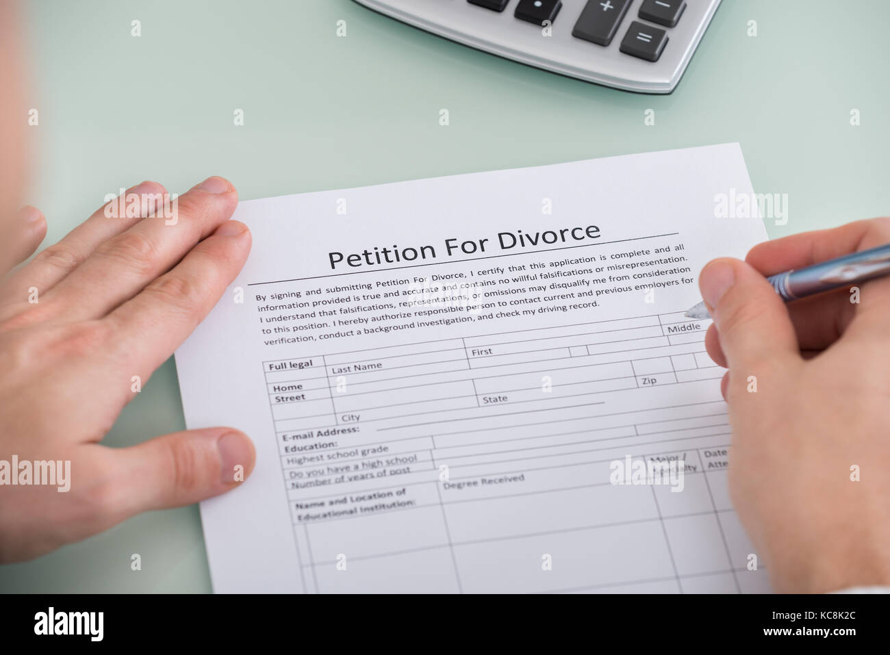 Close-up Of Person Hand Over Petition For Divorce Form Stock Photo - Alamy