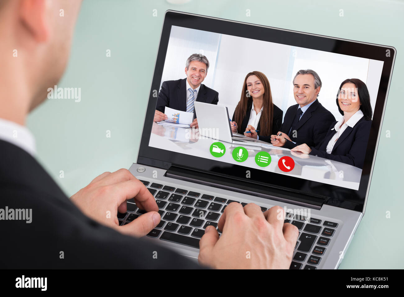 Close-up Of Businessman Looking At Video Conference On Laptop Stock ...