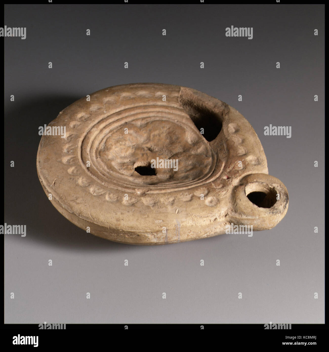 Lamp, Roman, Terracotta, Overall: 7/8 x 3 1/2 in. (2.2 x 8.9 cm ...