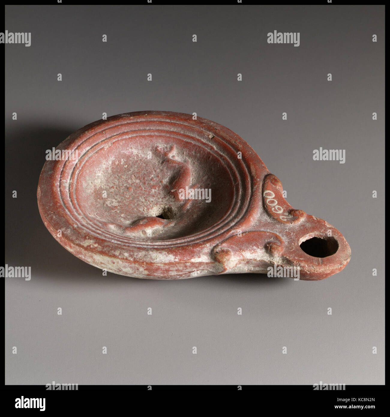 Terracotta lamp: on discus, two dolphins, 1st century B.C.–1st century ...
