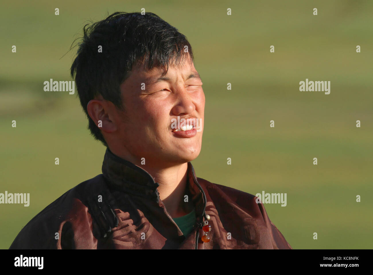 BAT-ULZII, MONGOLIA, July 12, 2013 : Young Mongolian man looks at his ...