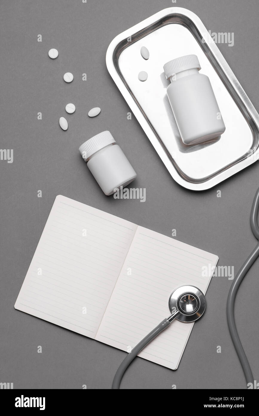 Top view of doctor desk table with stethoscope and medical items. Flat ...