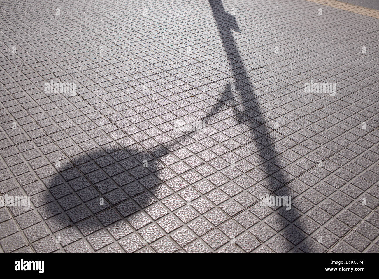 Abstract - light and shadow on the pavement blocks Stock Photo - Alamy