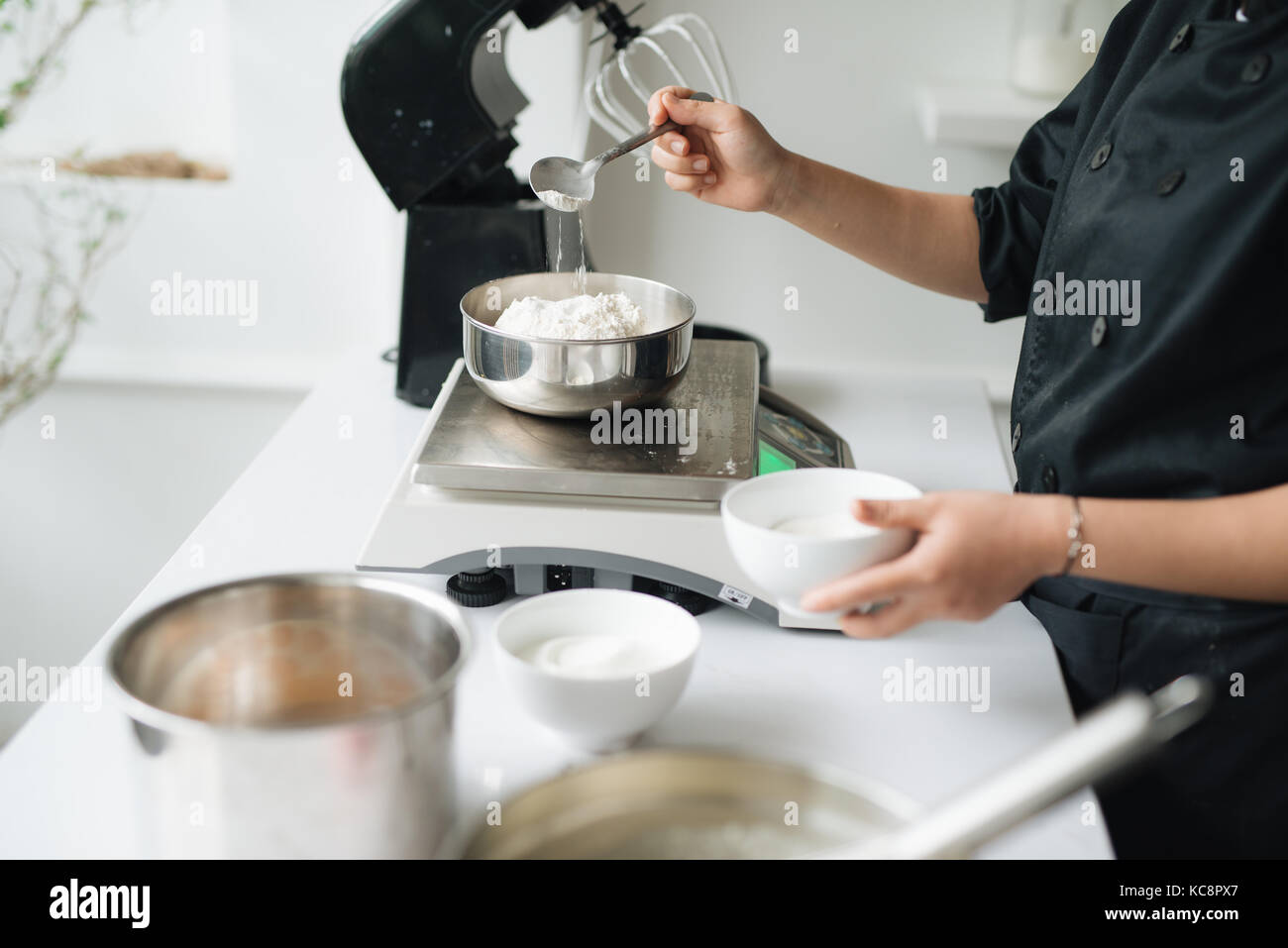 Bakery chef cooking bake in the kitchen professional Stock Photo - Alamy