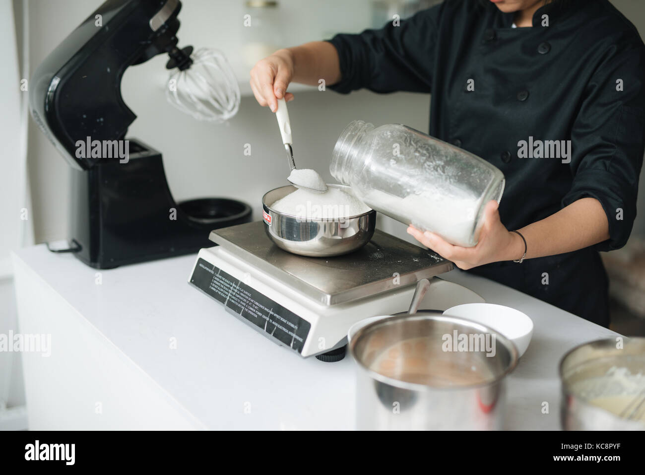 Bakery chef cooking bake in the kitchen professional Stock Photo - Alamy