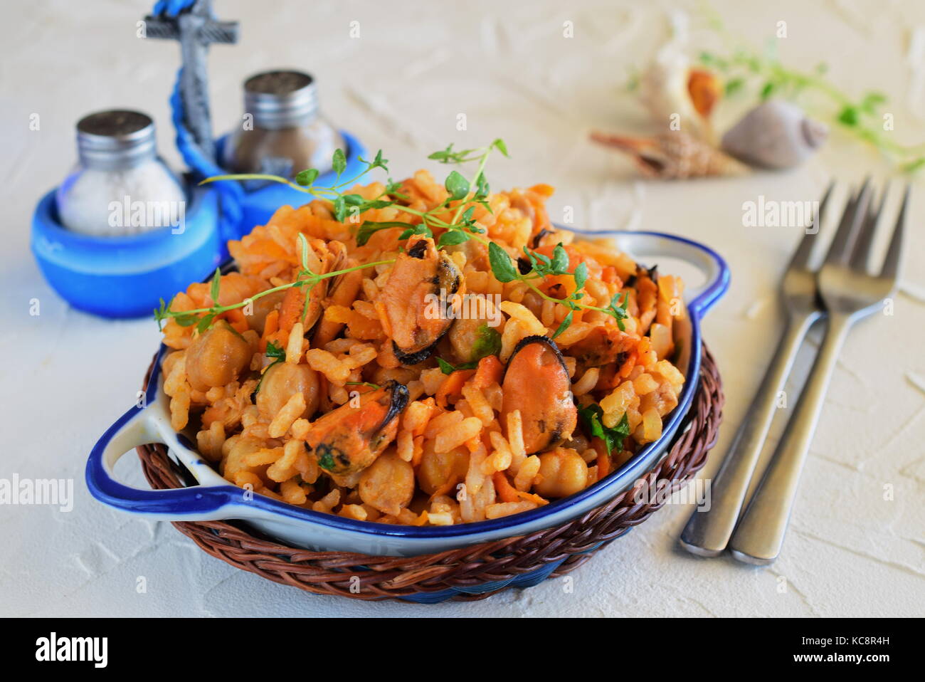 Rice with mussels, carrot and onion. Healthy eating concept ...