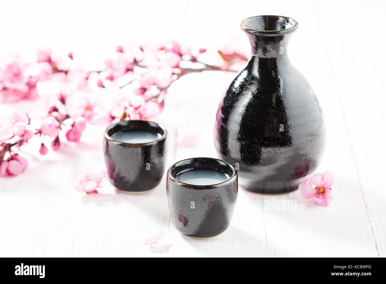 Delicious and good sake on white table Stock Photo - Alamy