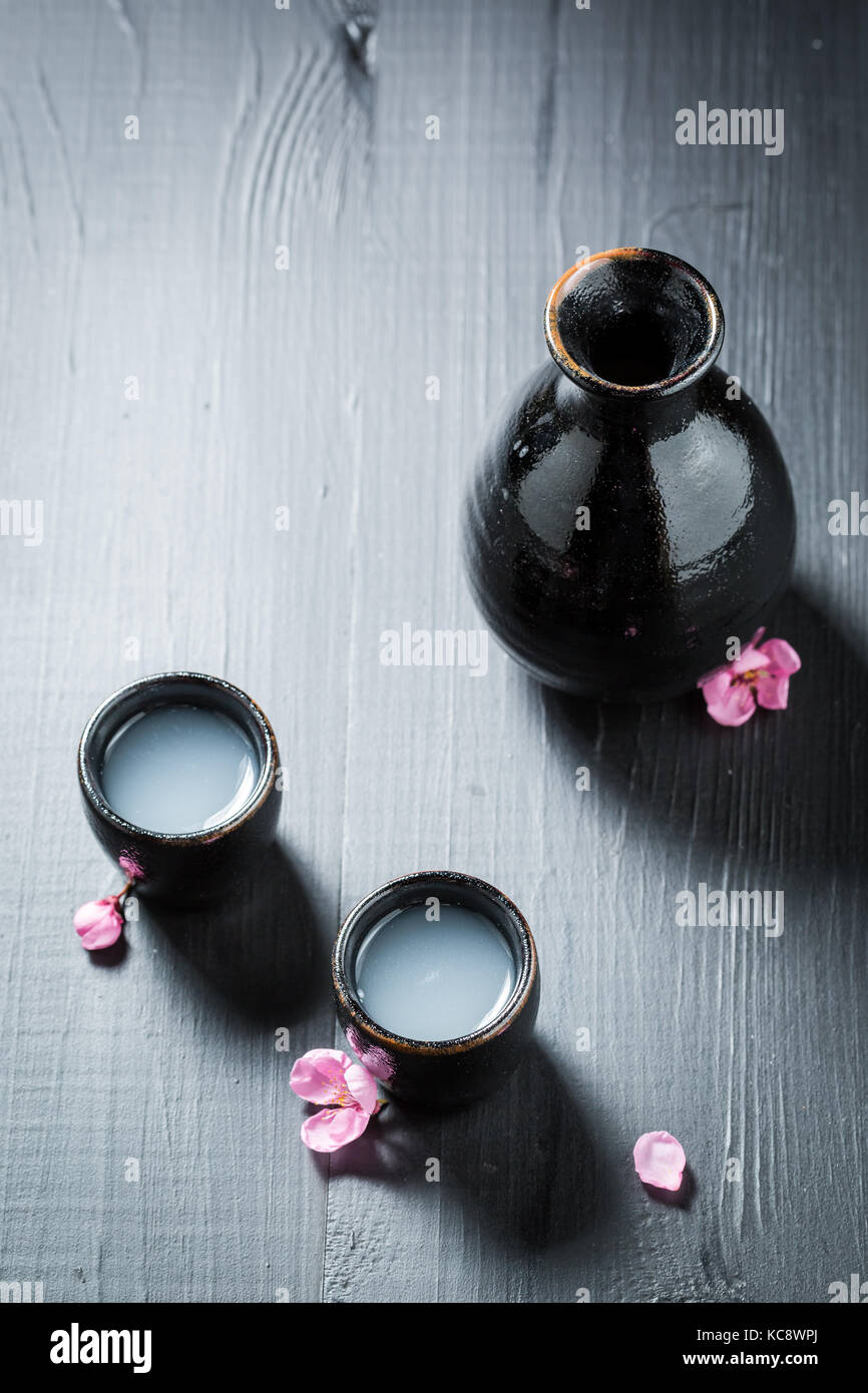 Traditional and delicate sake with flowers of blooming cherry Stock ...