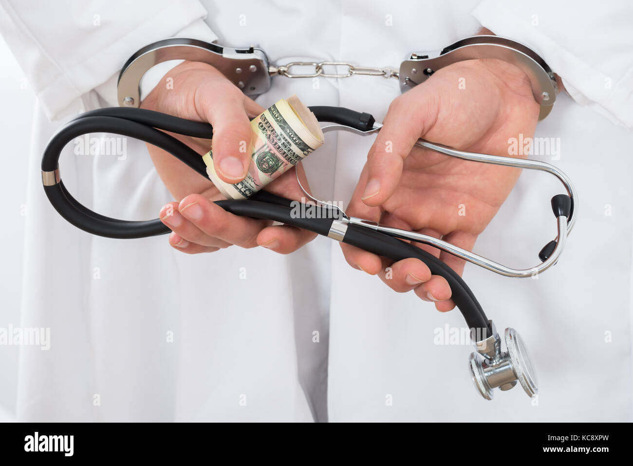 Doctor Money Handcuffs High Resolution Stock Photography and Images - Alamy