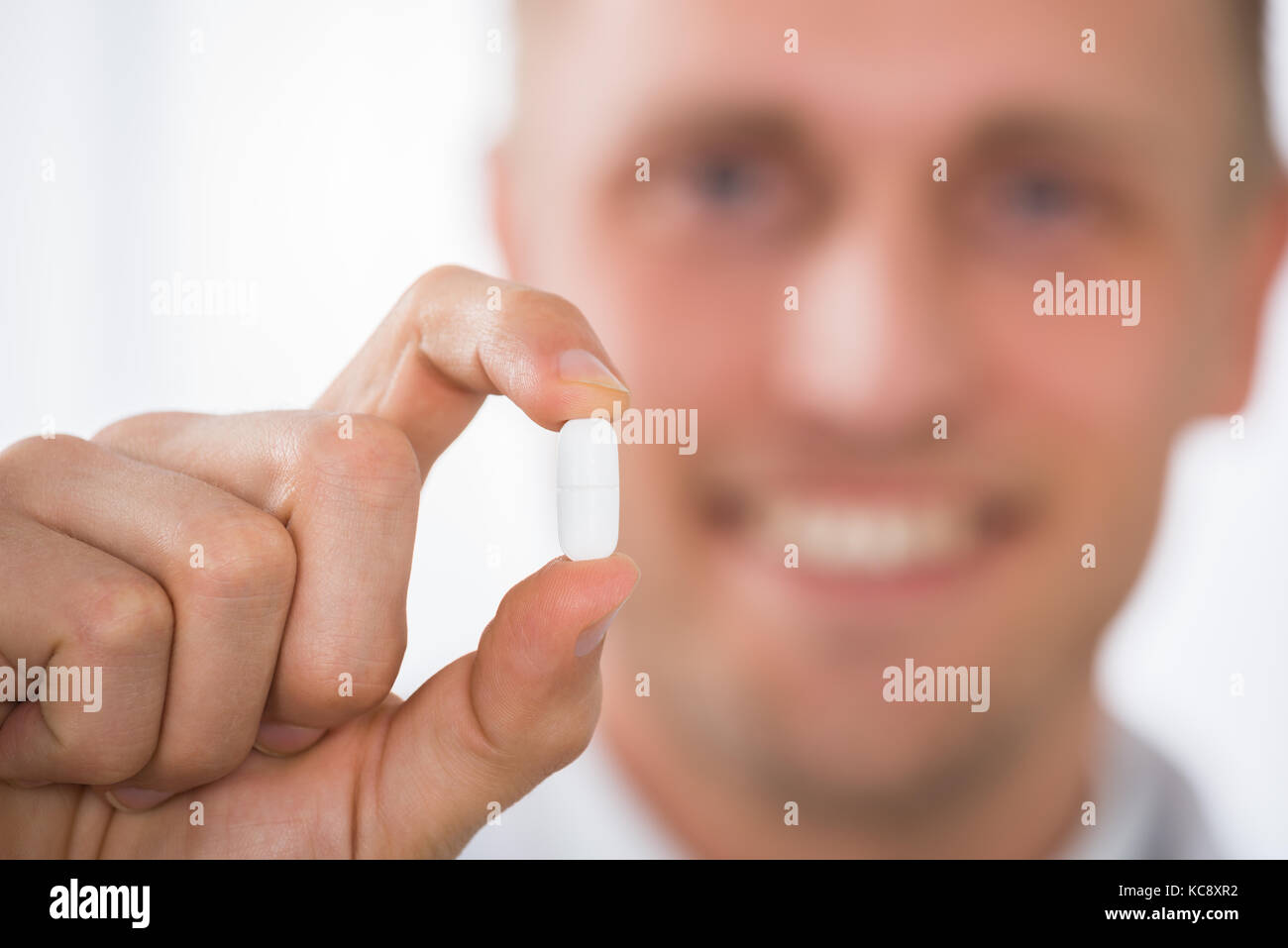 Close-up Of Happy Male Doctor Hand Holding Pill In Clinic Stock Photo ...