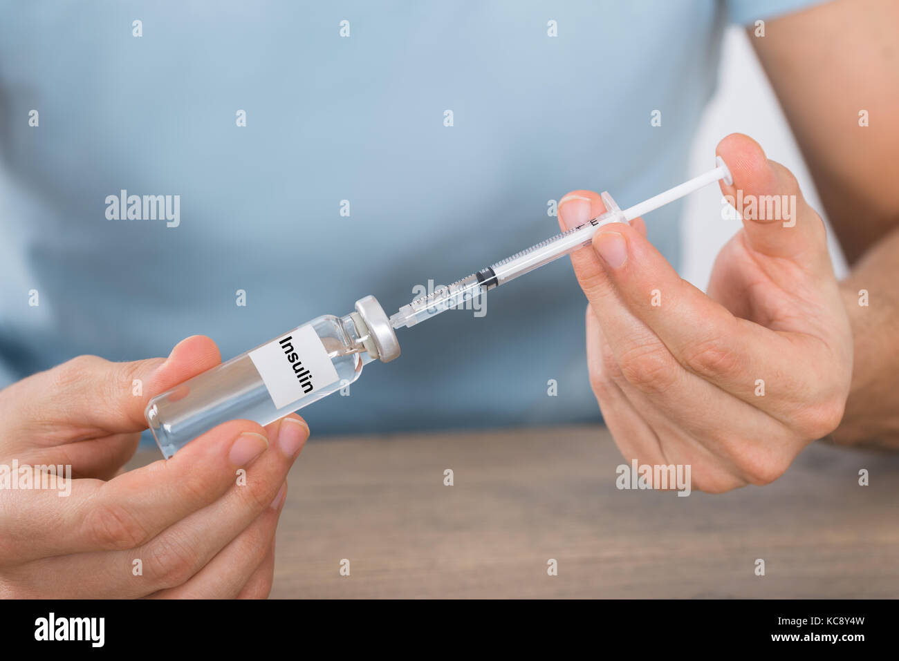 Close-up Of Young Man Holding Insulin And Syringe Stock Photo - Alamy
